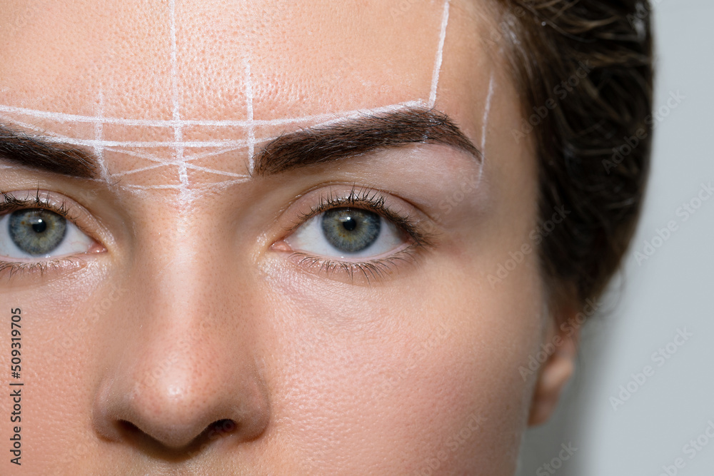 Woman during professional eyebrow mapping procedure Stock Photo | Adobe ...