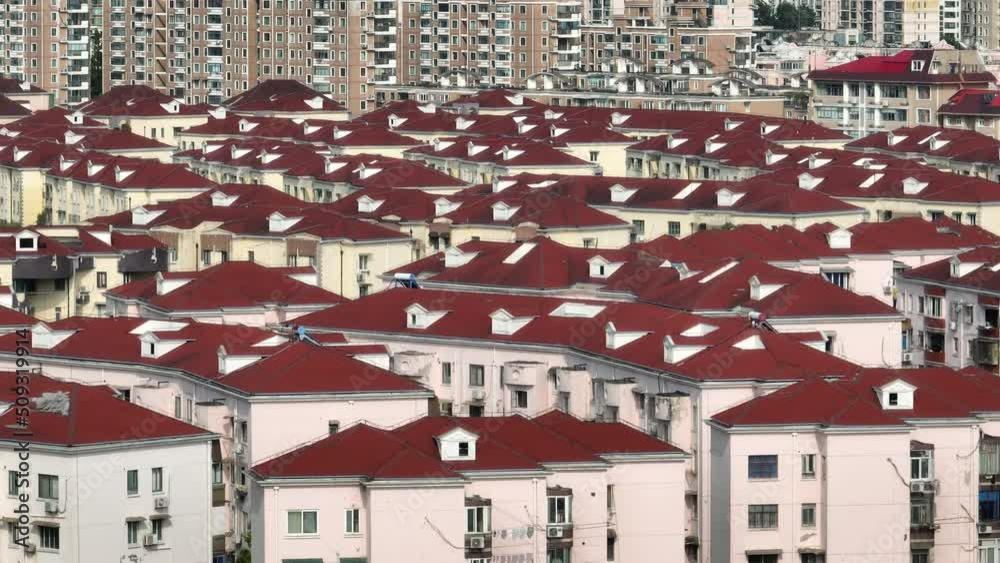 Drone aerial view of Crowded residential buildings with red roof. The ...