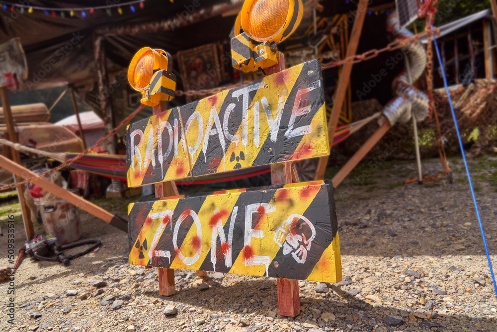 Radioactive Zone warning sign outside a tent camp after the destruction ...