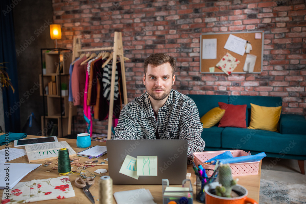 Ravishing looking man, nicely dressed is doing up measurements on a ...