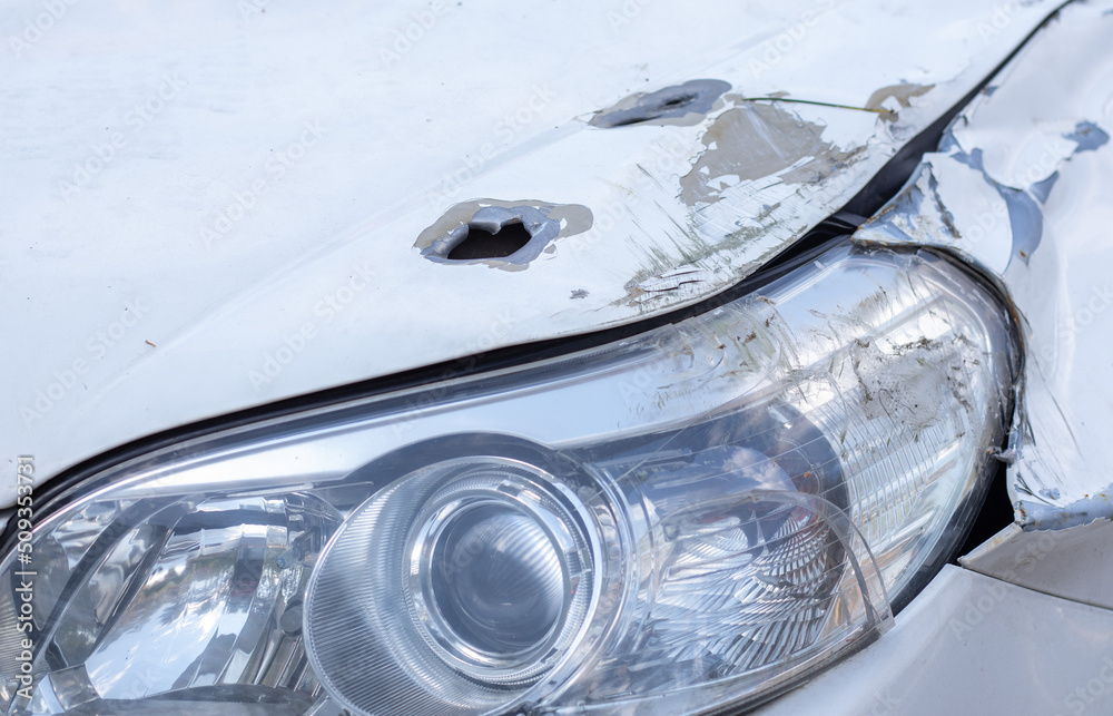 Foto de Car riddled with bullets. War of Russia against Ukraine. A car ...