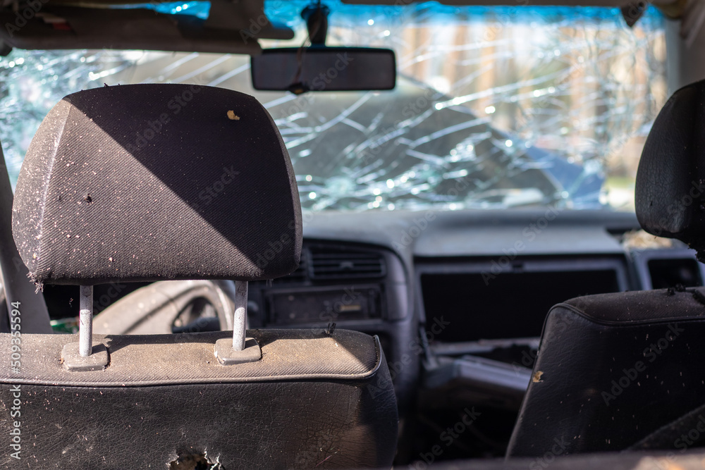 Damaged car window after an accident. Broken windshield as a result of ...