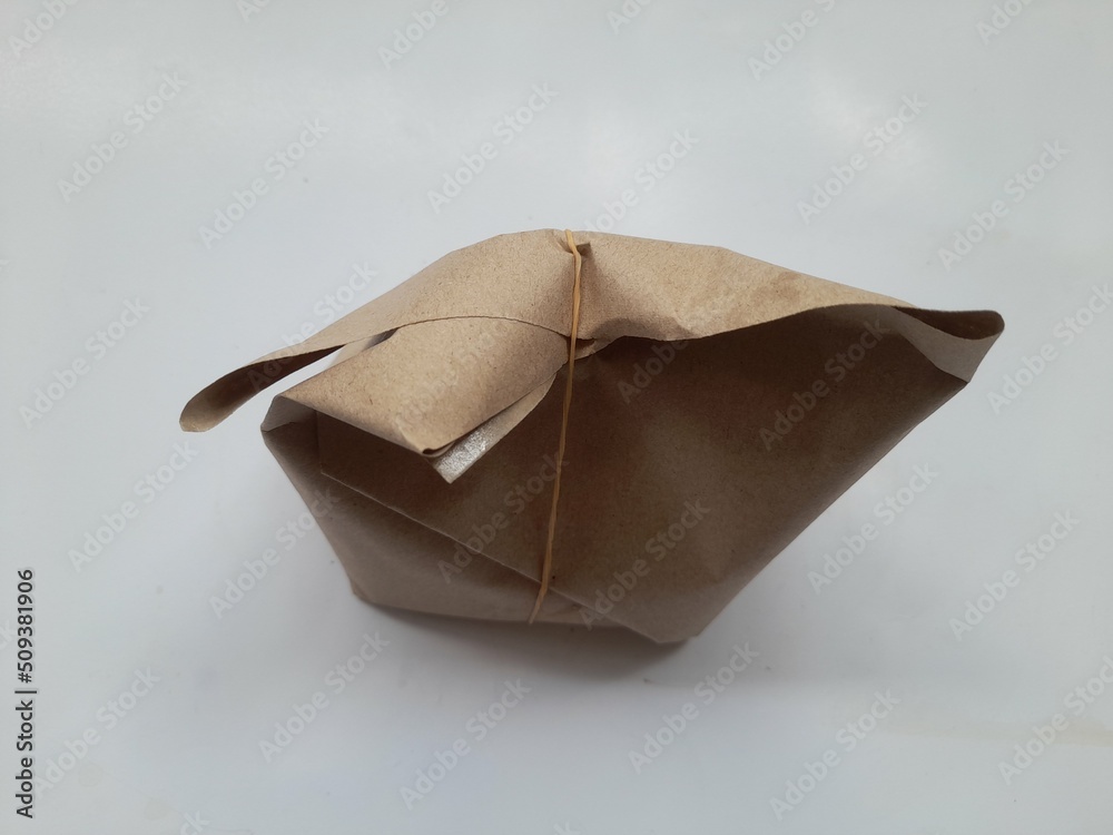 rice wrapped in rice paper top view on white background. food business ...