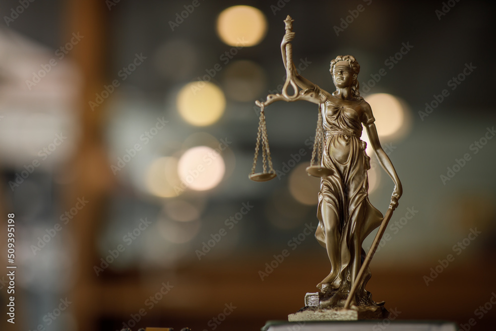Statue of Lady Justice with scales of justice and wooden judge gavel on ...