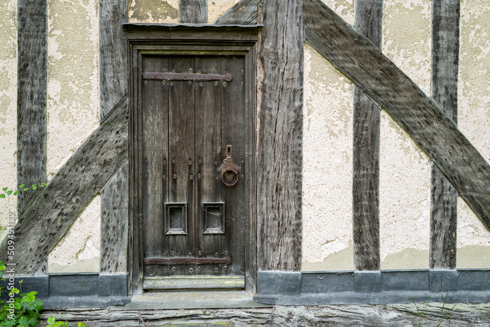 Exterior view of a Tudor built church showing the entrance the the ...