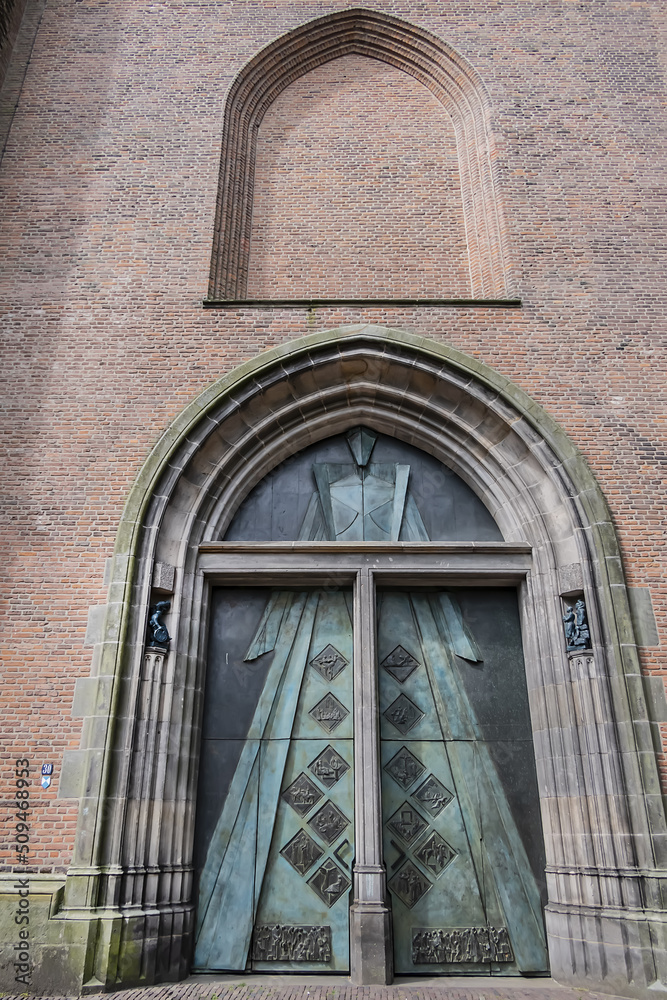 Entrance door to 98-meter high Onze Lieve Vrouwetoren (Our Lady tower ...