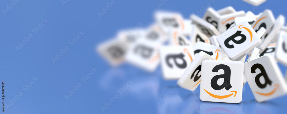 Amazon company logos fall on a table. Banner format with copy space and ...