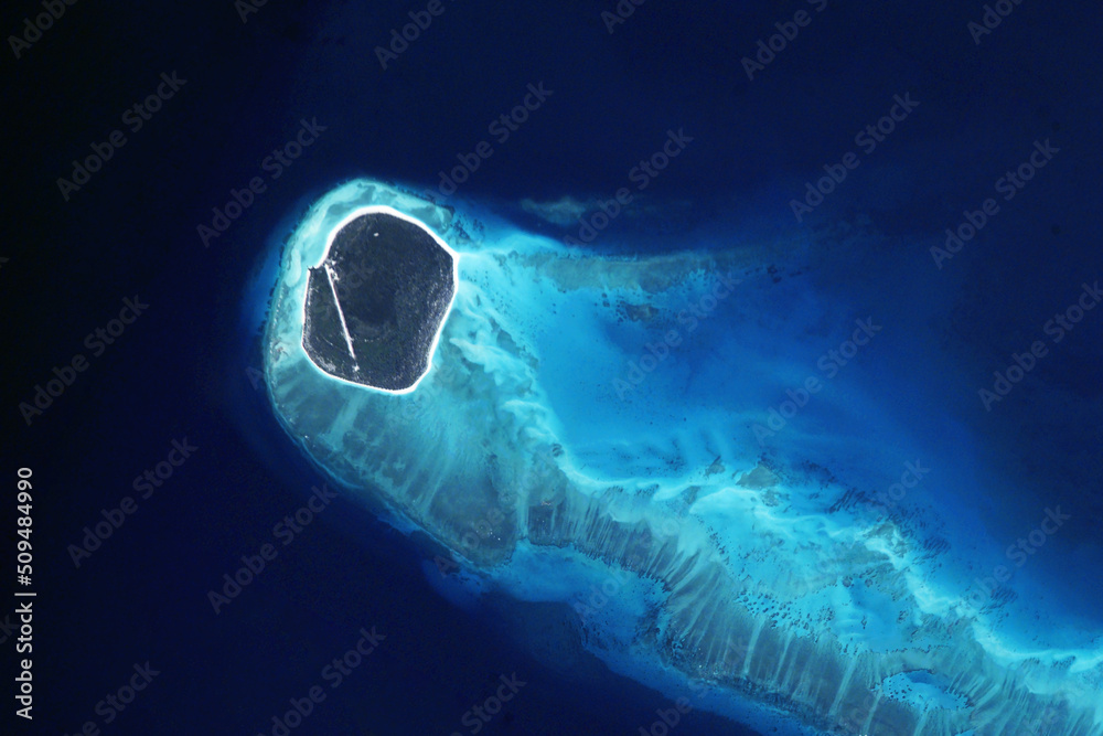 Island in the ocean from space. Elements of this image furnished by ...