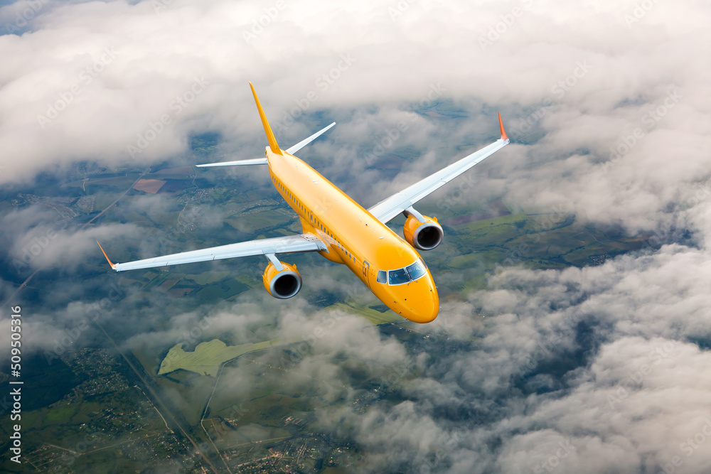 Foto de Orange passenger aircraft in flight. The orange plane flies ...