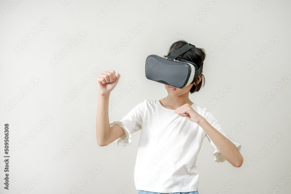 Asian child girl with boxing in VR headset training for punch in ...