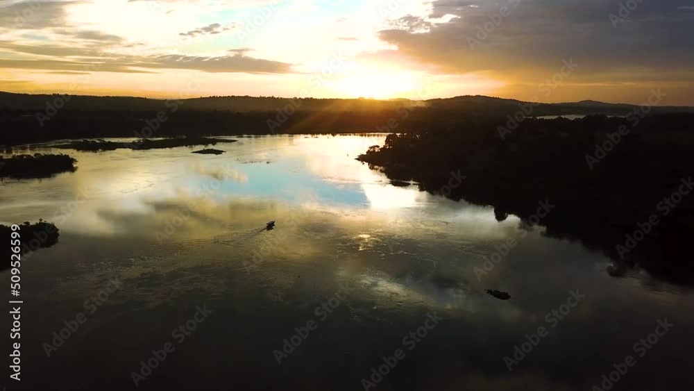 Wonderful natural scenery in Africa. Boat is sailing to warm sunset ...