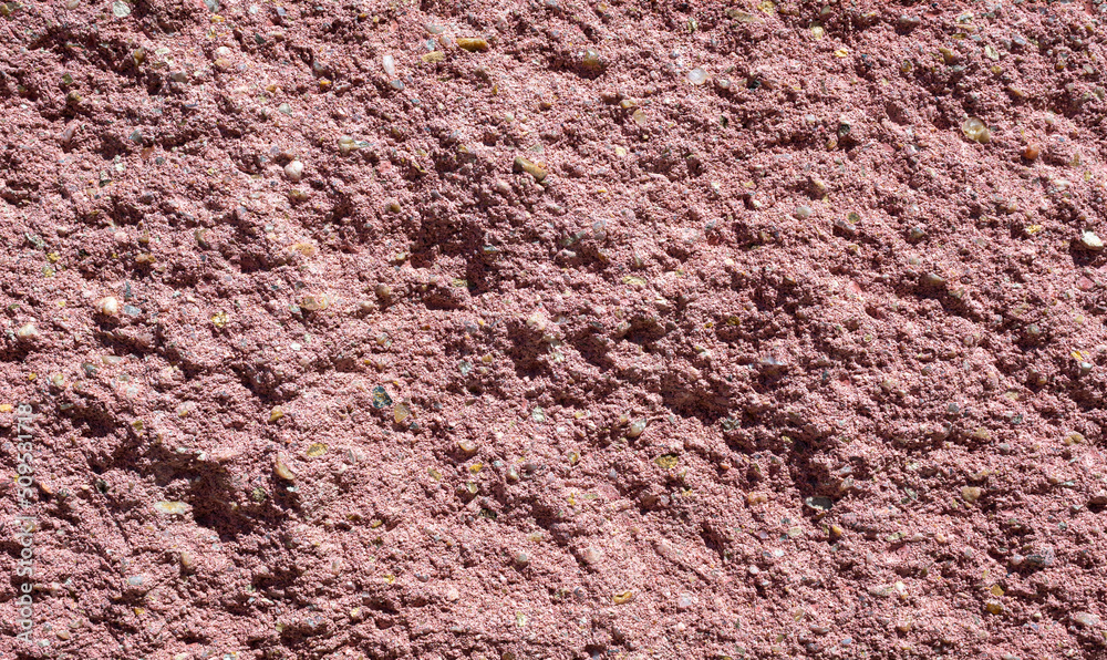 Textura y fondo de pared rugosa y áspera de cemento coloreado de rojo ...