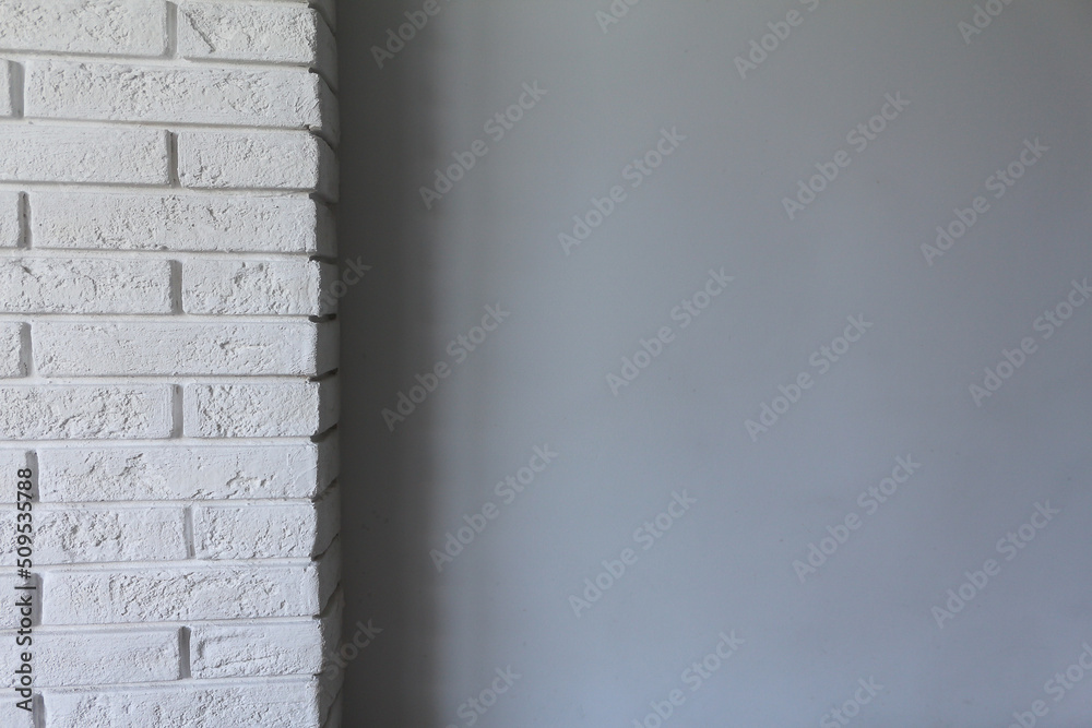 White decorative brick on a grey wall. Scandinavian interior ...