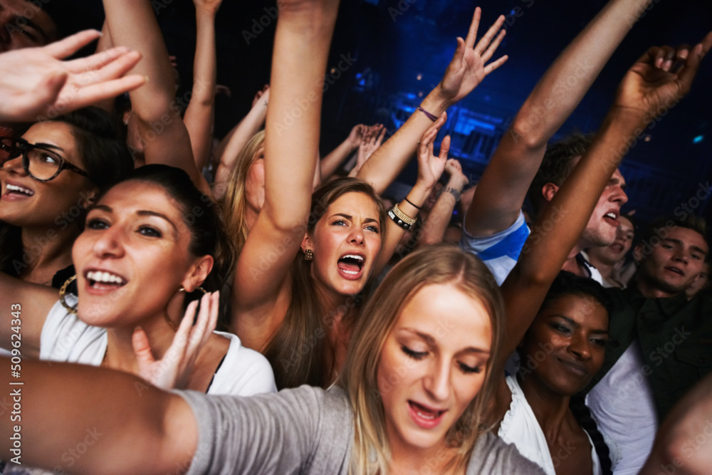 Golden circle. Attractive female fans enjoying a concert- This concert ...