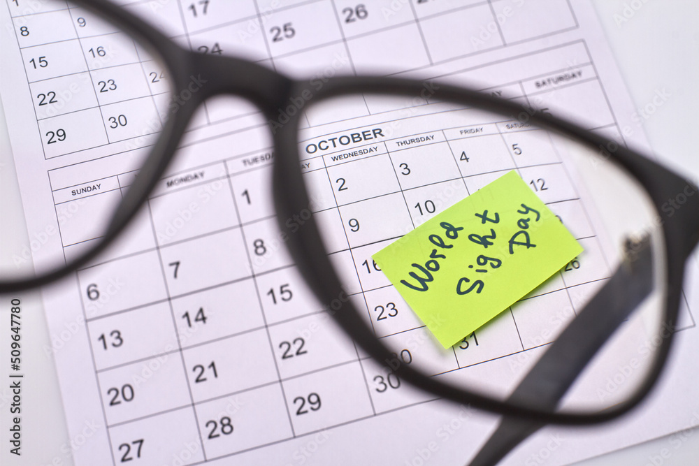 Vision through the glasses on the paper month calendar and paper note ...