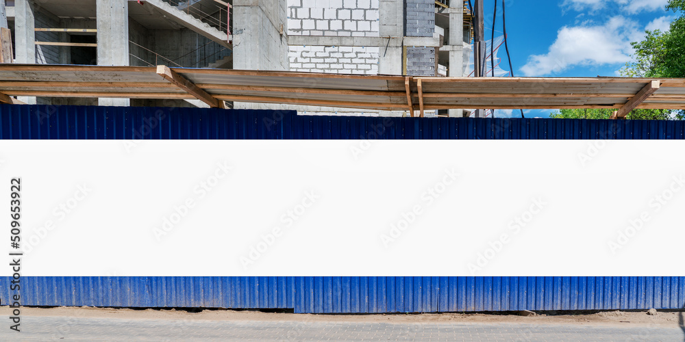 Large blank information banner fixed on blue steel fence of ...