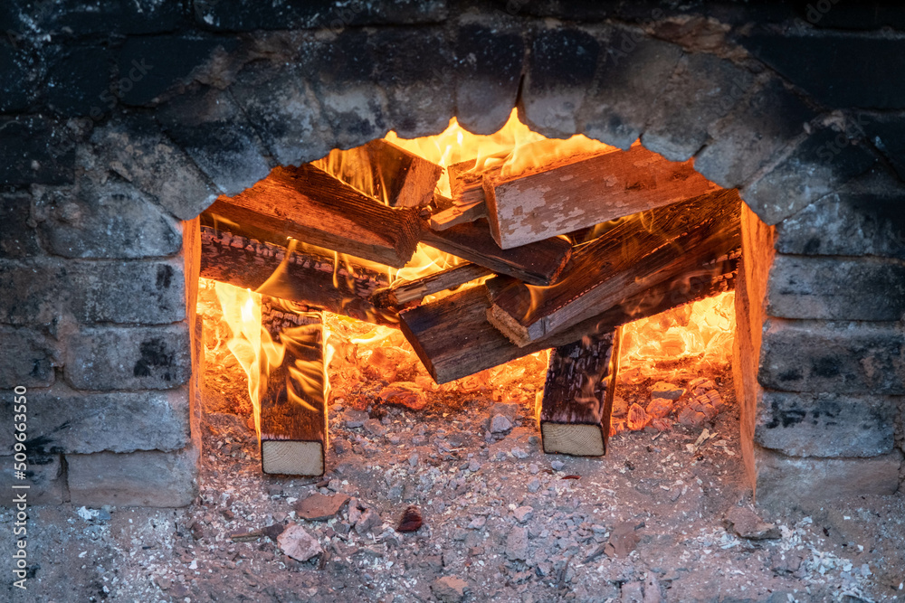Firing of wood fire kiln is part of process for black pottery. Unique ...