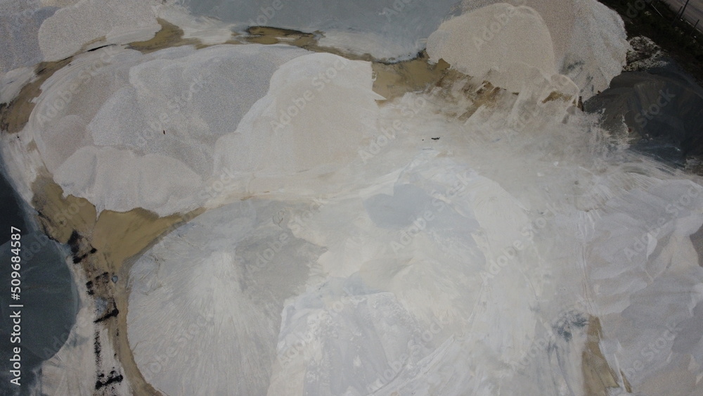 An aerial view of the piles of fine stone in the quarry. Fine stone is ...
