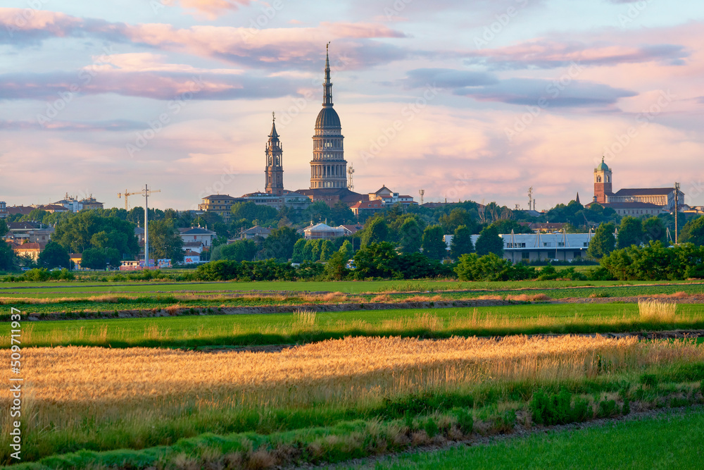 Early summer sunrise Antonelli Dome skyline of the city of Novara ...