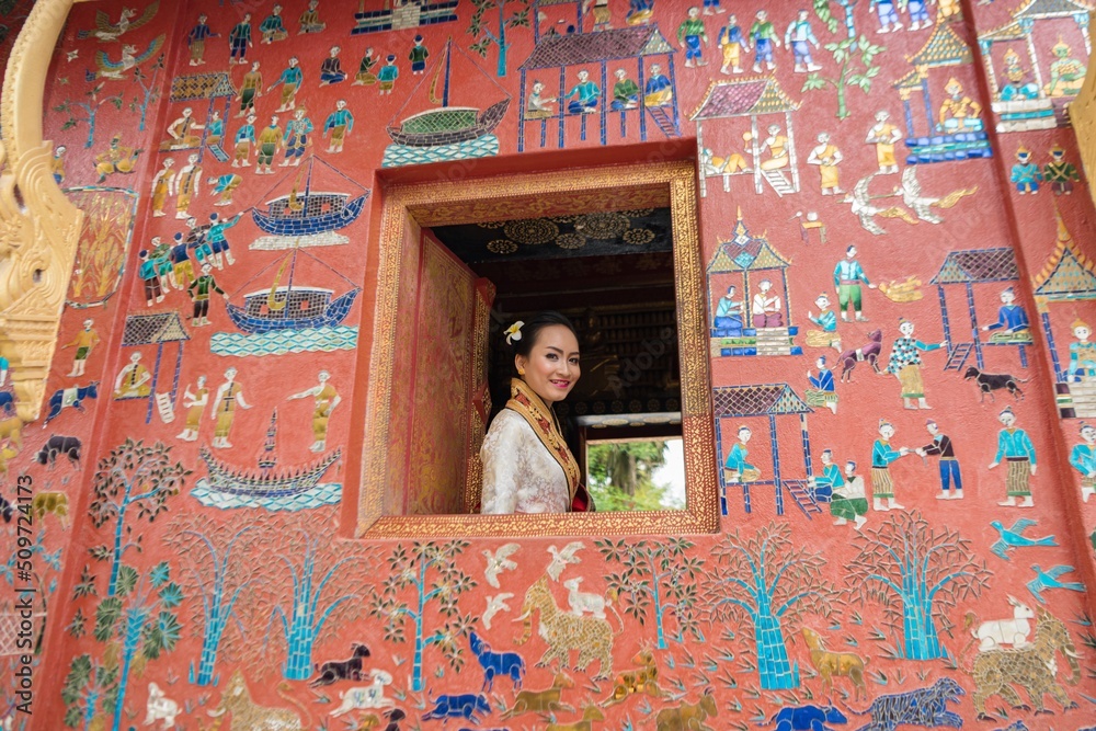 Asian Laos female lady wearing traditional Lao costume smile friendly ...