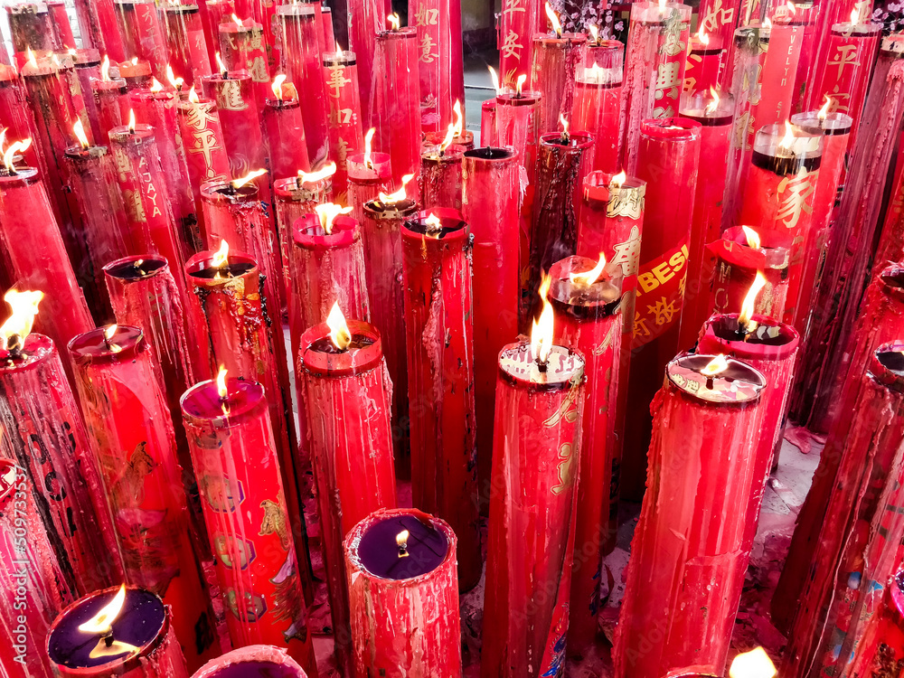 Big red candles in the temple. The temple is generally used as a place ...