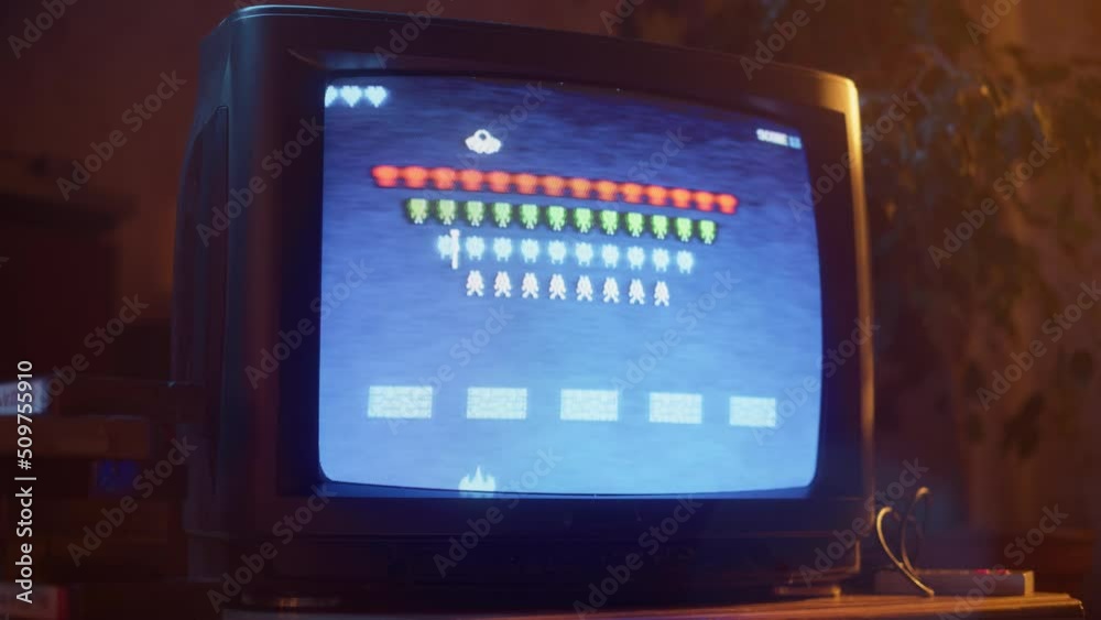 Close Up Footage of a Retro TV Set Screen with an 8 Bit 2D Eighties ...