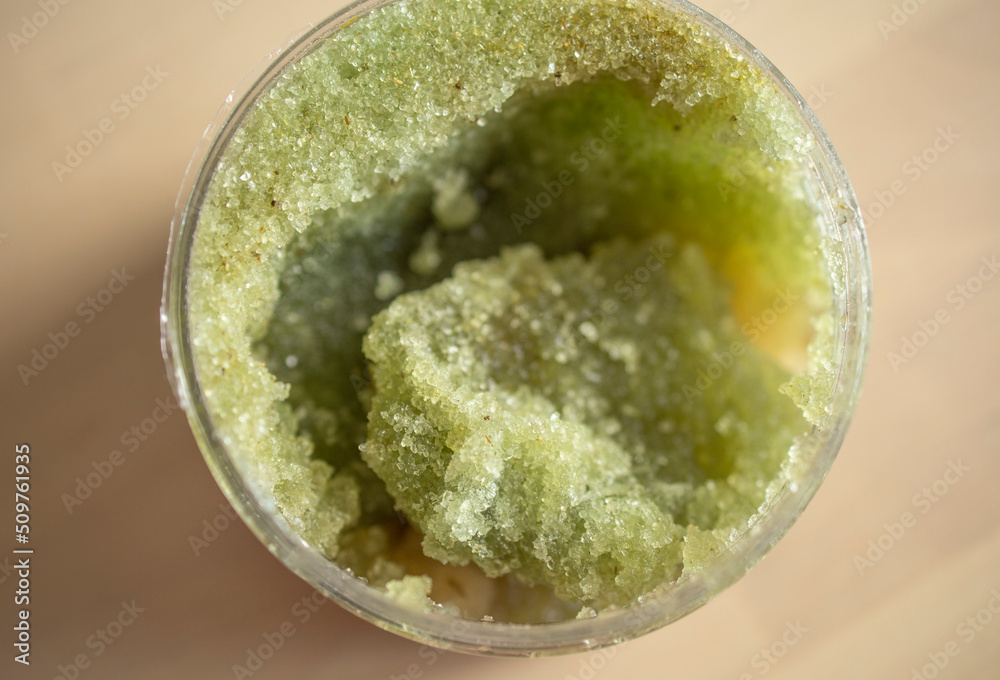 jar with green scrub, with large particles, for face, body, natural ...