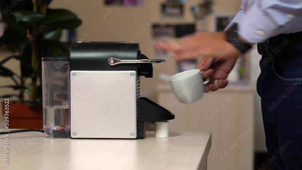 Coffee machine in working office. Men's hand making expresso. The male ...