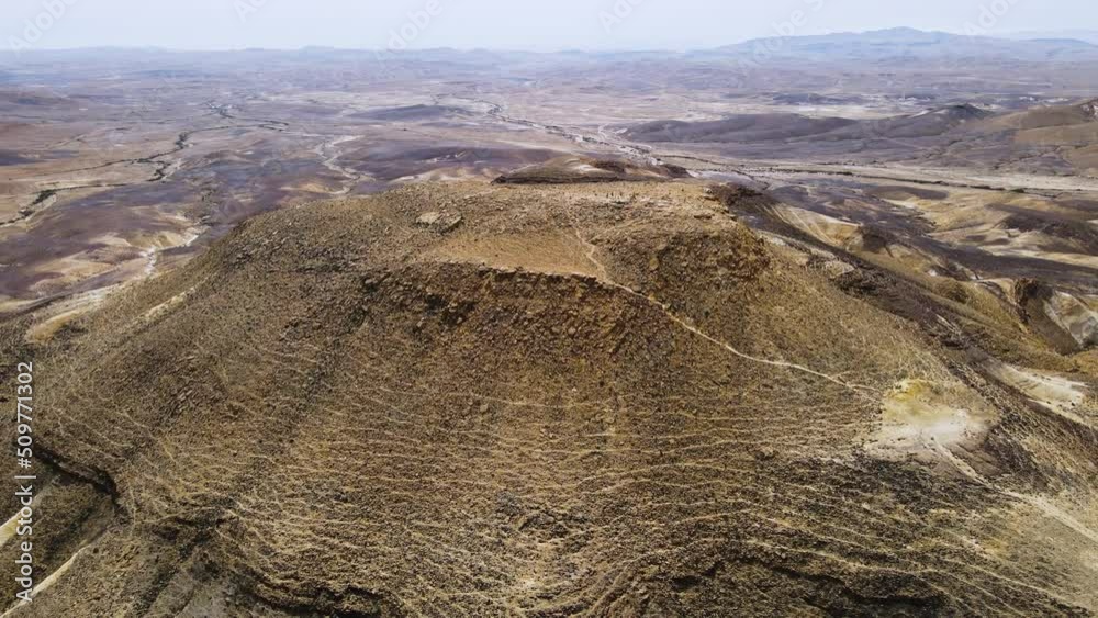 Aerial orbit and zoom out of Mount Ramon and reveal of the Ramon Crater ...