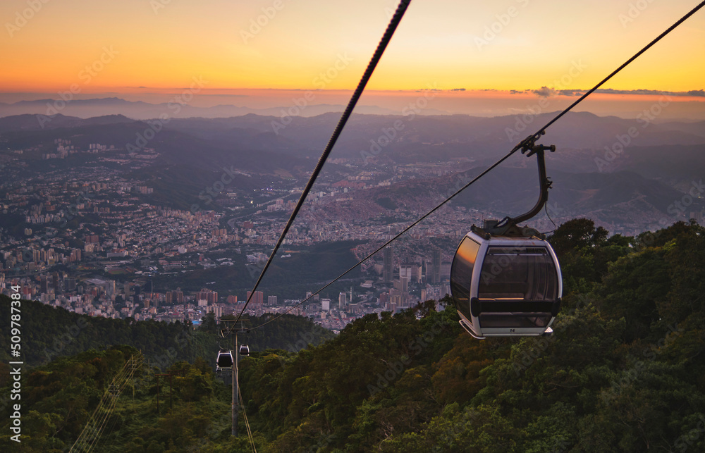 Modular cabins cable car against the bright sky, clouds ans mountains ...