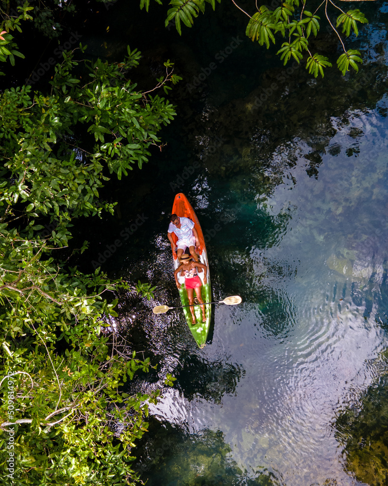 couple in a kayak in the jungle of Krabi Thailand, men and woman in ...
