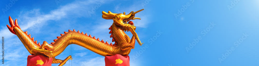 Inflatable Chinese dragon against the blue sky, copy space. Year of the ...