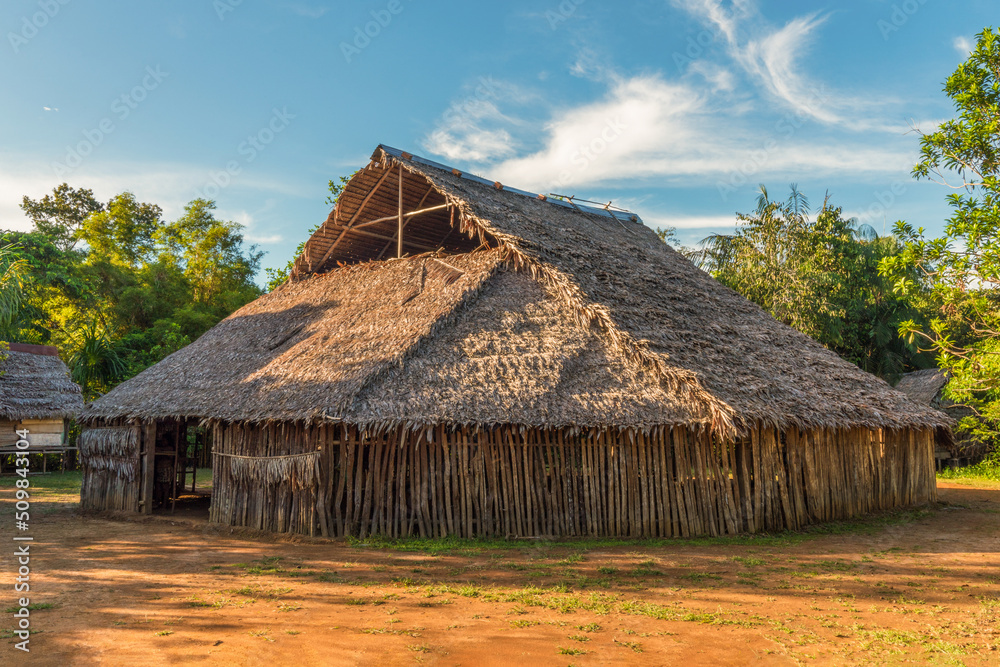 A tribal meeting hall built with wood and leaves by indigenous people ...