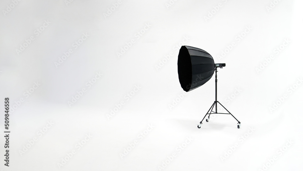 One studio lights of softbox and octobox stand against background of ...