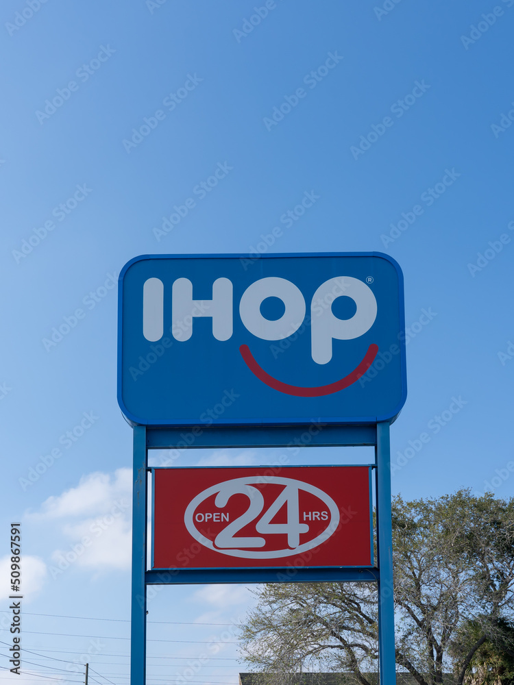 Pearland, TX, USA - February 7, 2022: IHOP pole sign with blue sky in ...