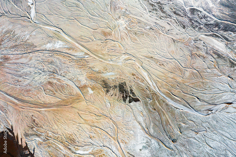 Abstract background or texture depicting a wavy pattern of earth and ...