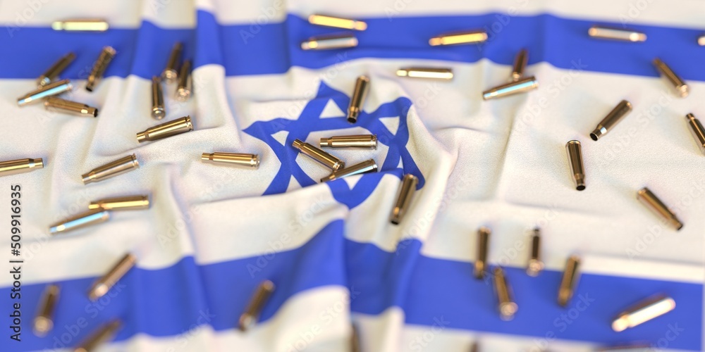 Scattered bullet shells on the flag of Israel. Crime or violence ...