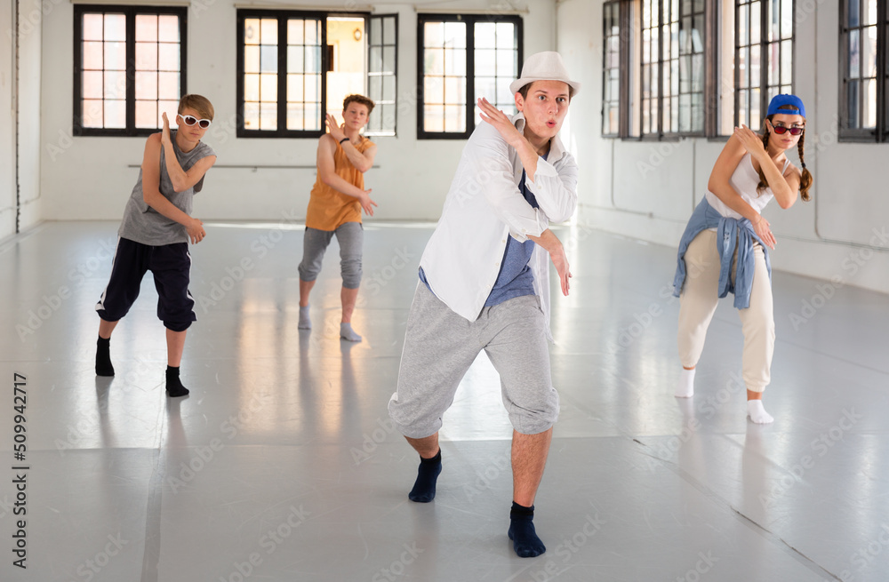 Team of young dancers training street dance moves and having fun Stock ...
