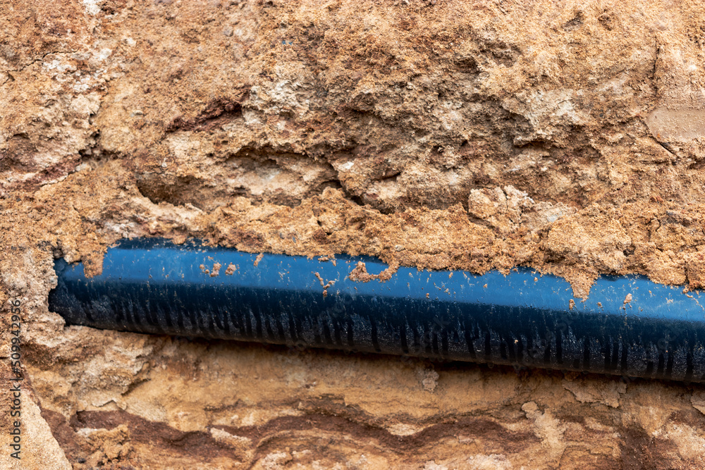 The high voltage electrical cable is laid in a trench under existing ...