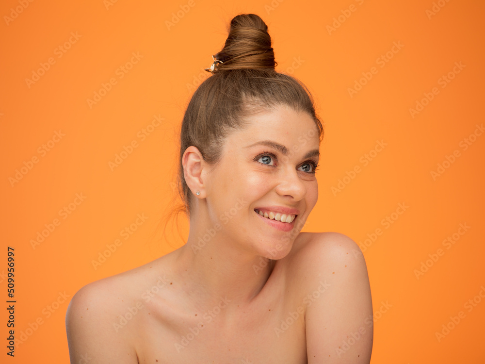Smiling Woman With Bare Shoulders And Bun Hairstyle Looking Away Isolated Portrait In Beauty