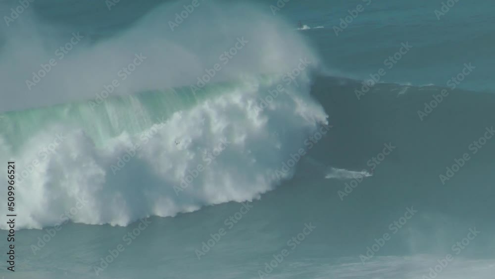 surfer riding the most gigantic waves in the world Portugal Nazare ...