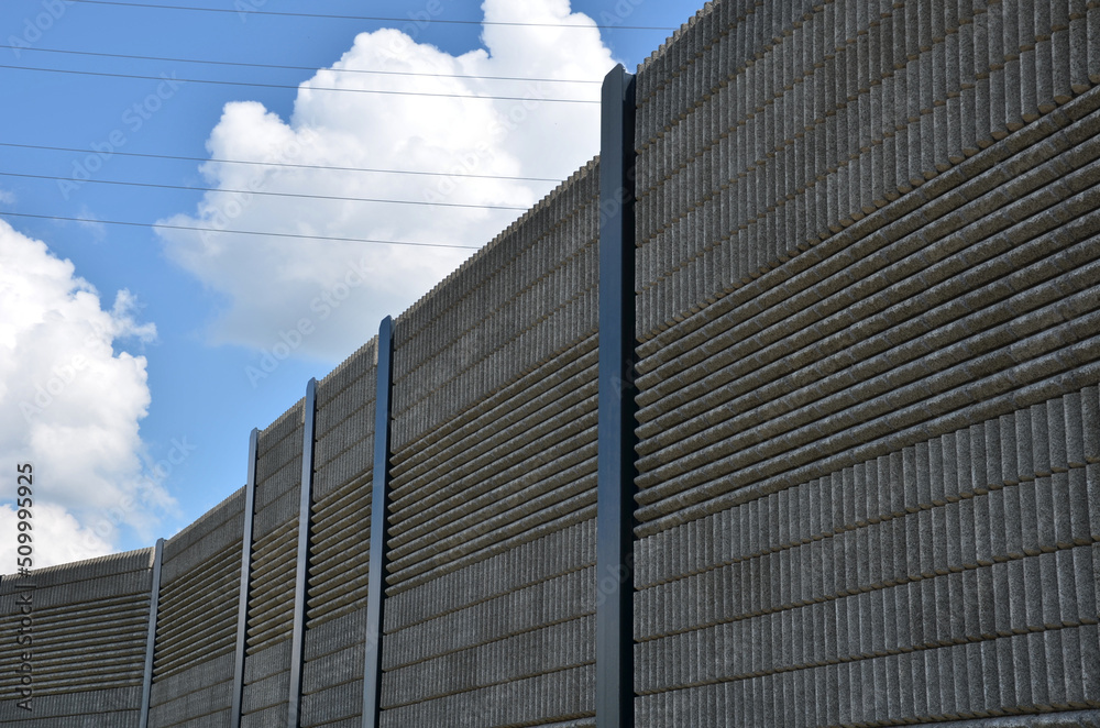 soundproof wall made of concrete porous ribbed material. fence of brown ...