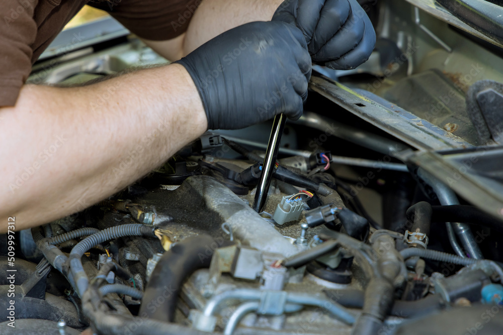 Emergency repair of a car on replacement on a car spark with a view of ...