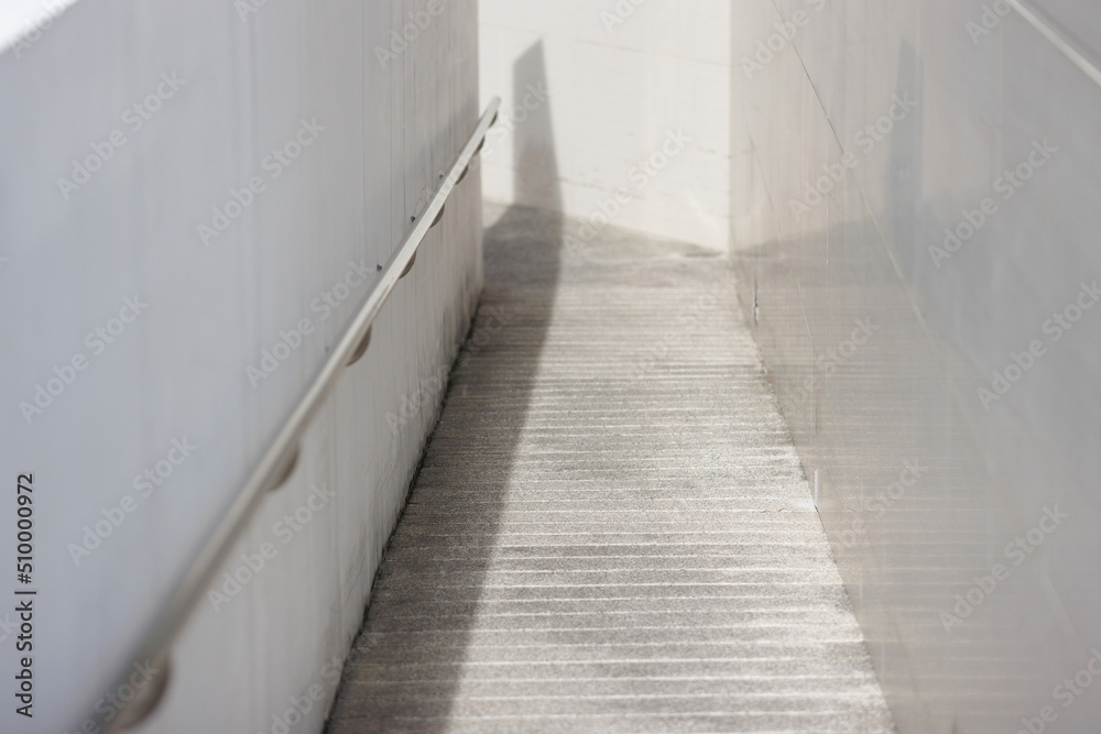 A concrete wheelchair ramp. path way for support wheelchair disabled ...