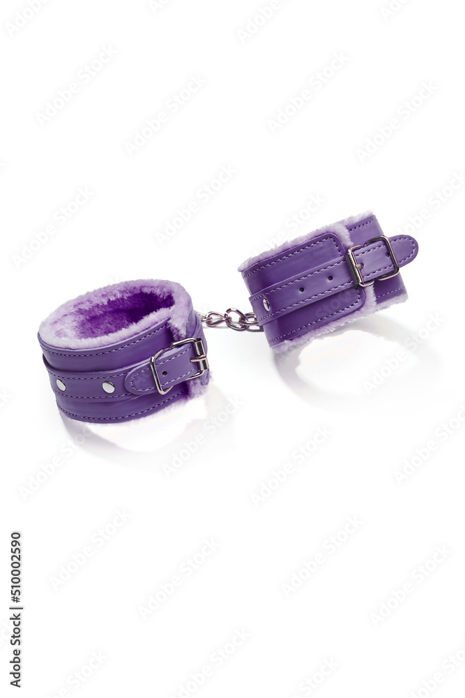 Close-up shot of purple leather shackles for hands or legs and for ...