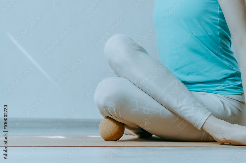 Person in garudasana yoga pose with cork ball on outer shin Stock Photo ...
