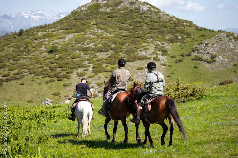 Group of people riding on a horse together, walking and discovering new ...