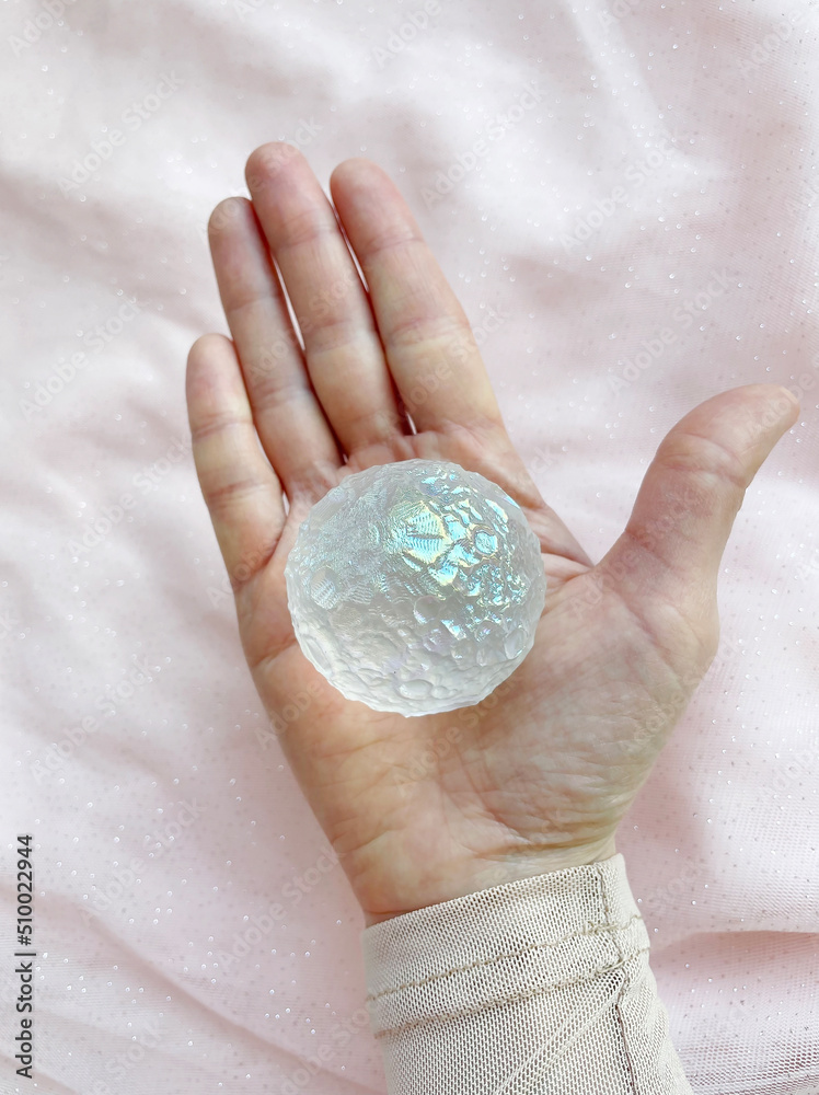 Magician's hand of the sorceress holds a crustall in the shape of the ...