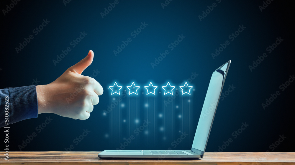 The concept of five stars. The best rating on the Internet. Hand ...