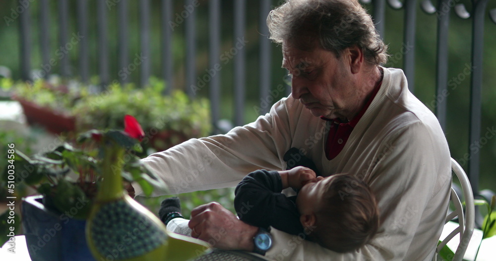 Casual grandfather with grandson baby at home. Candid real life grand ...